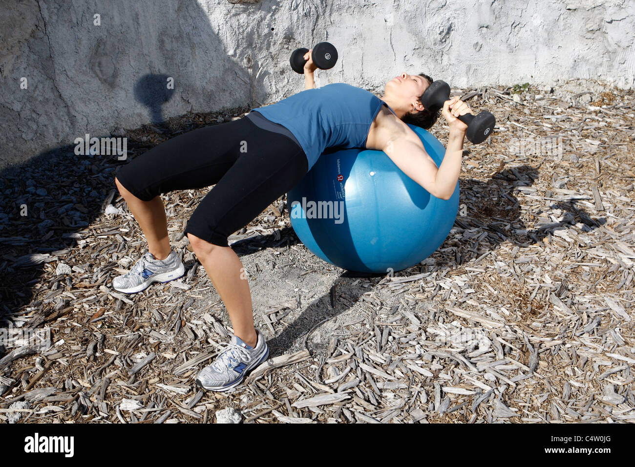 young woman working out outdoors Stock Photo - Alamy