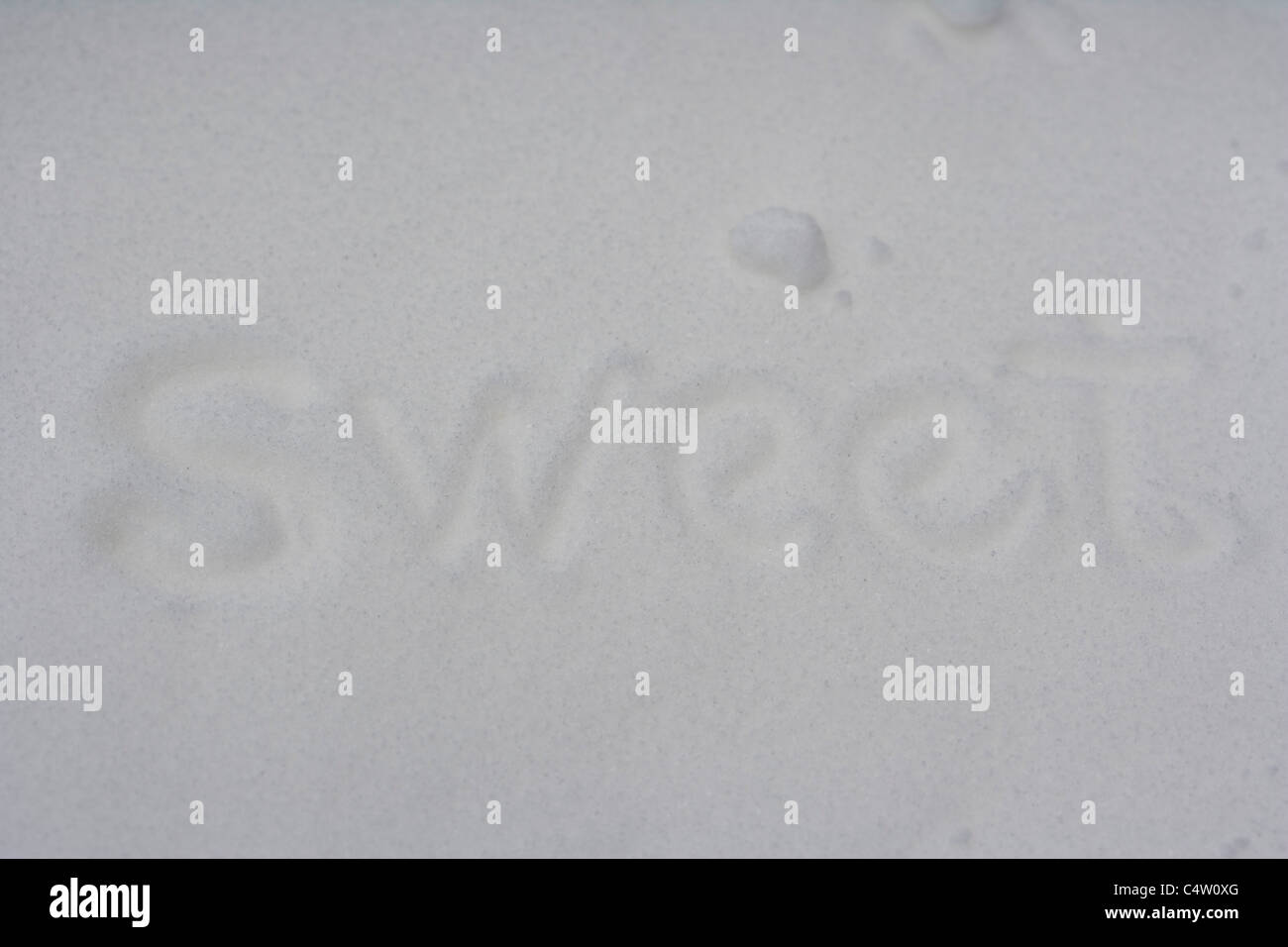 Word sweet written on castor sugar Stock Photo - Alamy