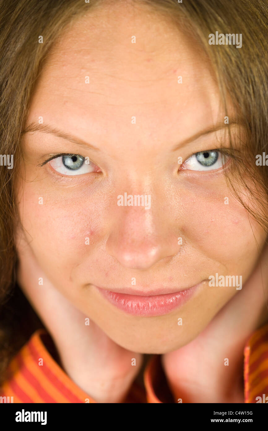 Portrait of 18 years old girl in orange shirt Stock Photo - Alamy