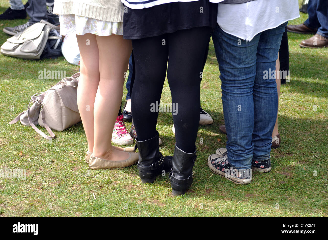 Teenage girls legs, group standing together Stock Photo - Alamy
