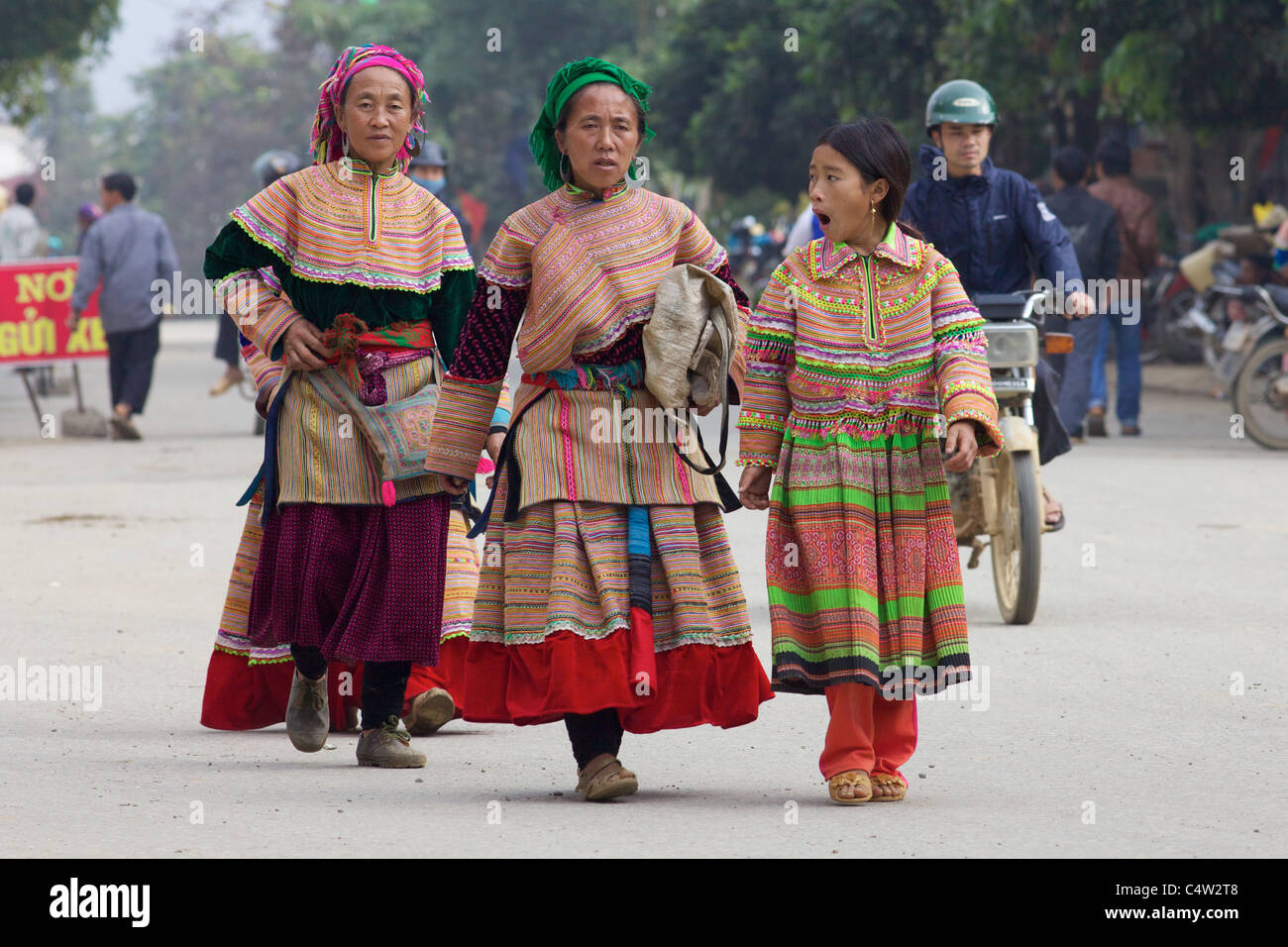 Three women of the Flower Hmong Ethnic Minority People walking in Bac ...