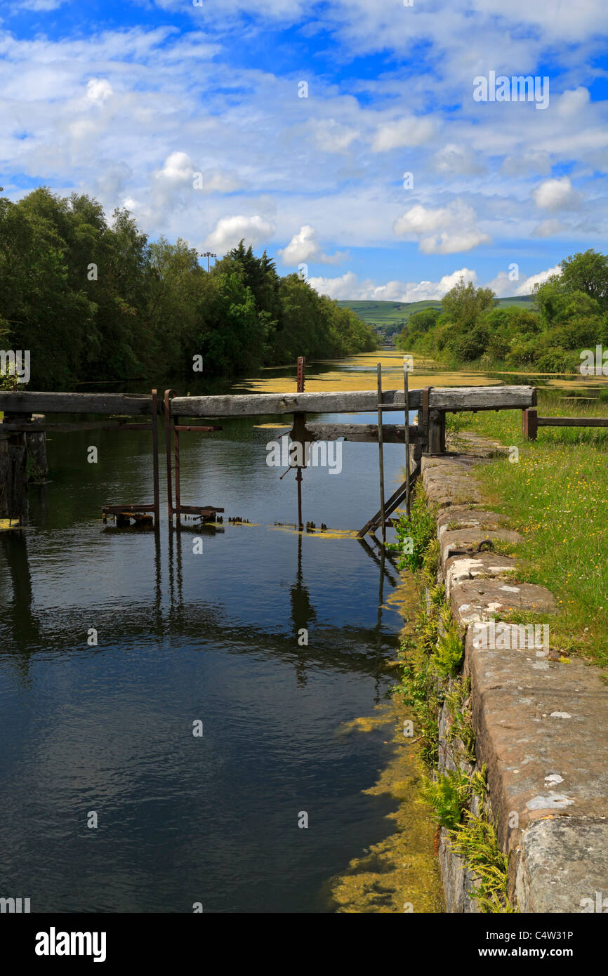 The lock gates of the the derelict Ulverston Canal. Commercial trade on ...