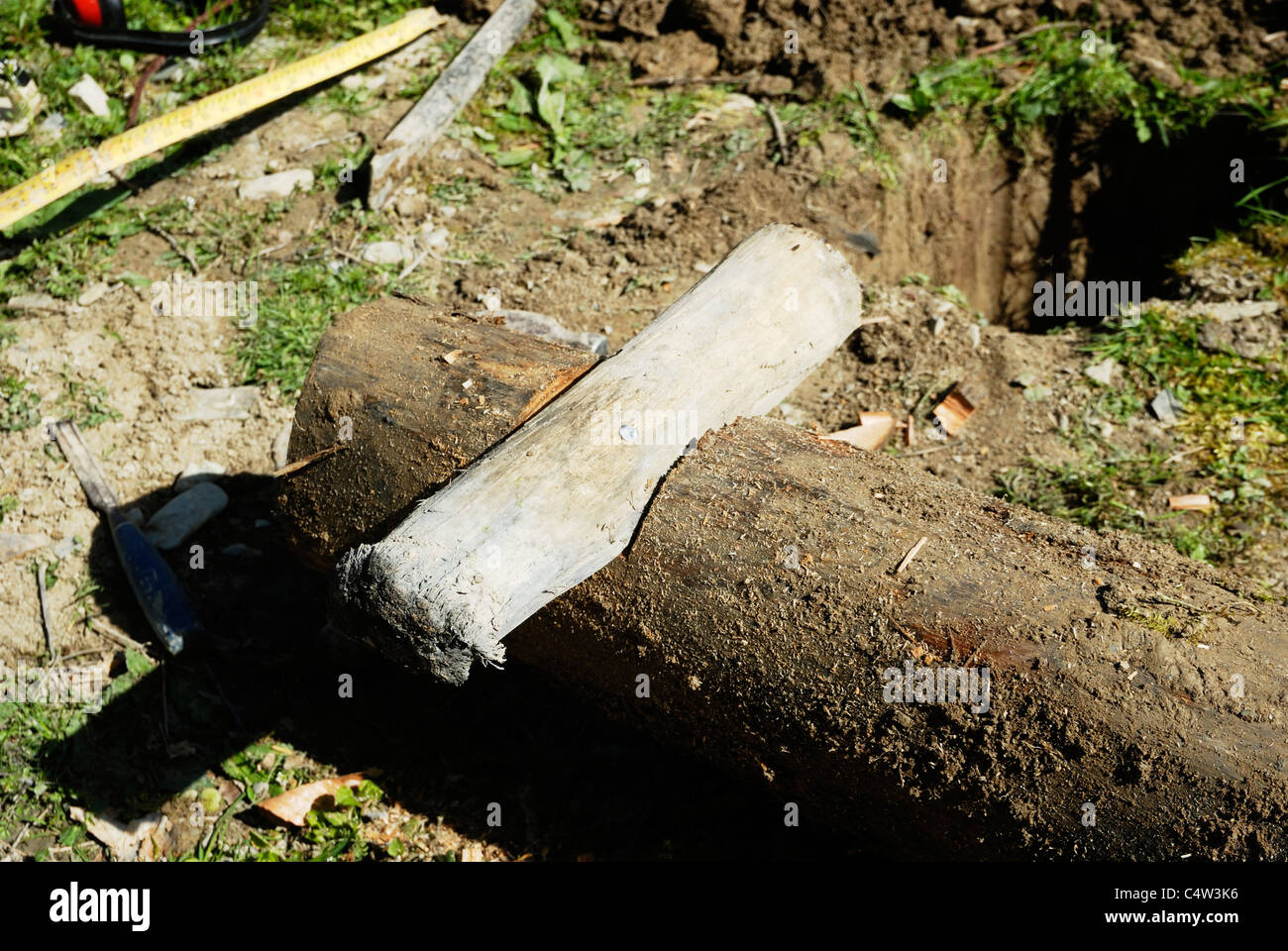 Wooden "foot" attached to the base of a timber straining post to add ...
