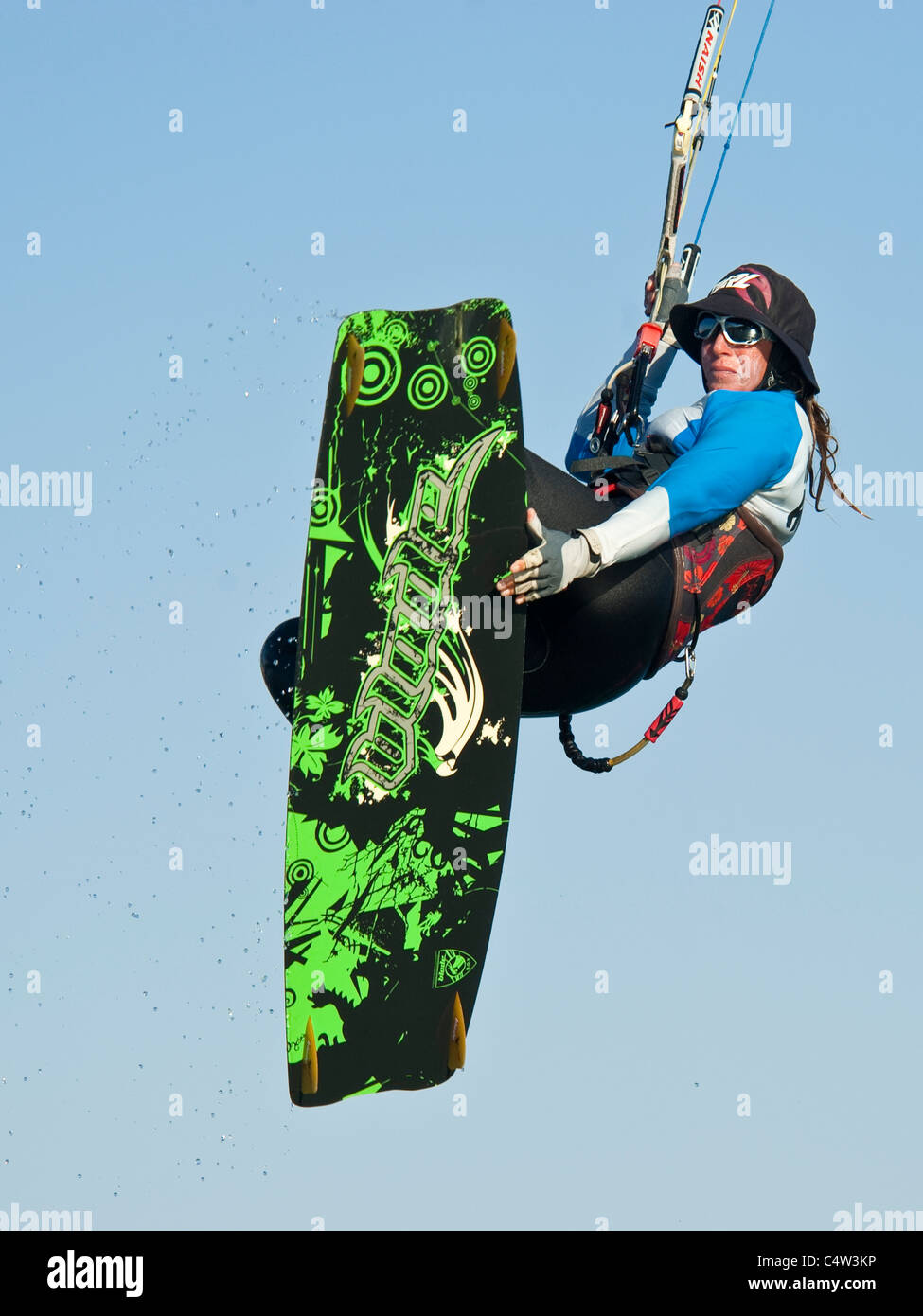 A close up view of a kite surfer in the middle of a jump at the resort ...