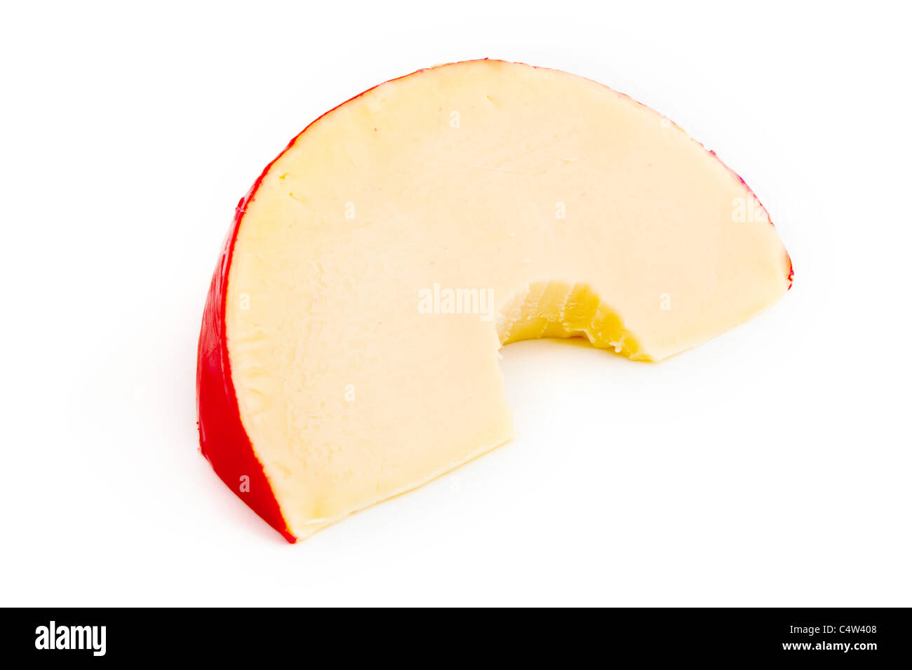 Edam cheese slice with a missing bite isolated on white Stock Photo - Alamy