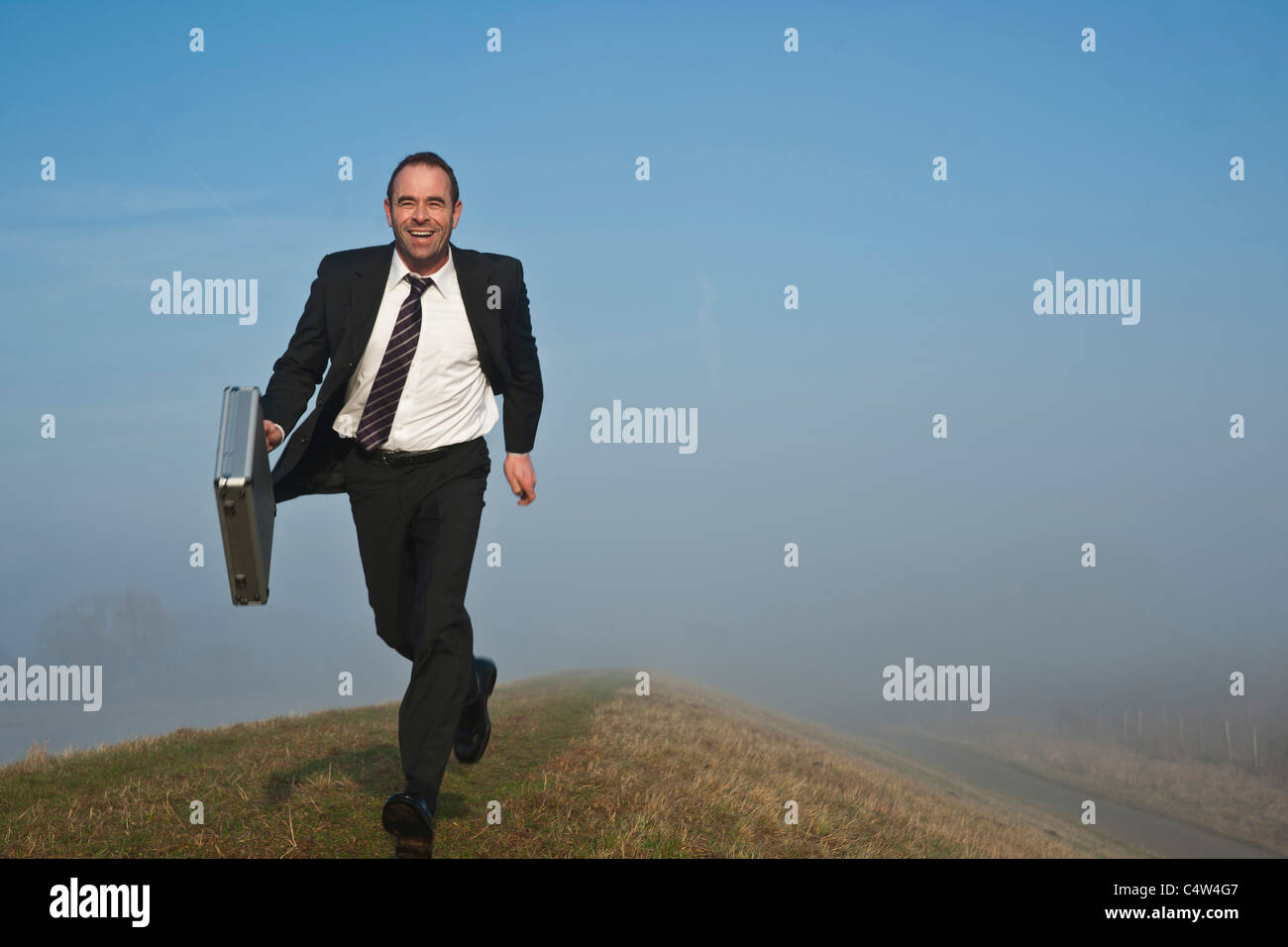 Businessman running hill hi-res stock photography and images - Alamy