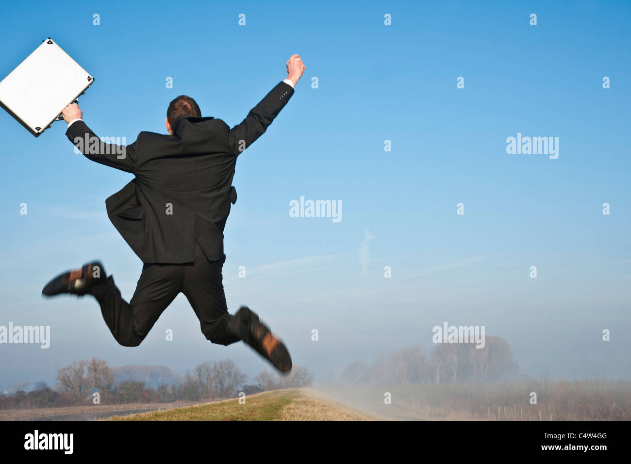 Person jumping in air office attire hi-res stock photography and images ...