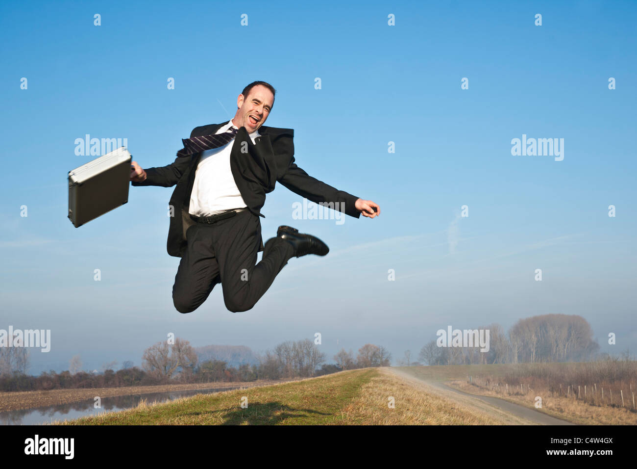 Person jumping in air office attire hi-res stock photography and images ...