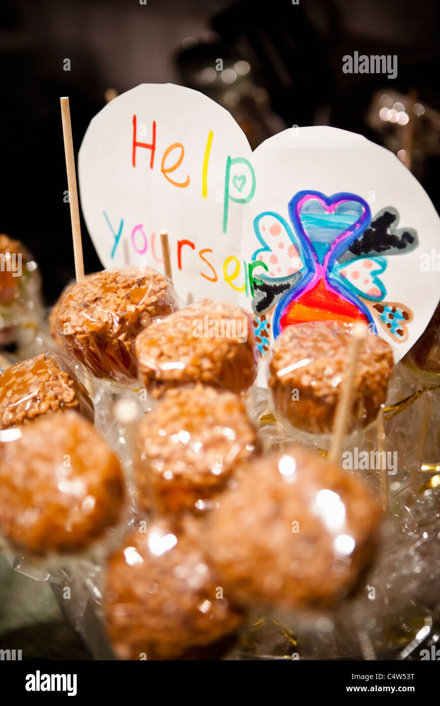 Treats with Help Yourself Sign Stock Photo - Alamy