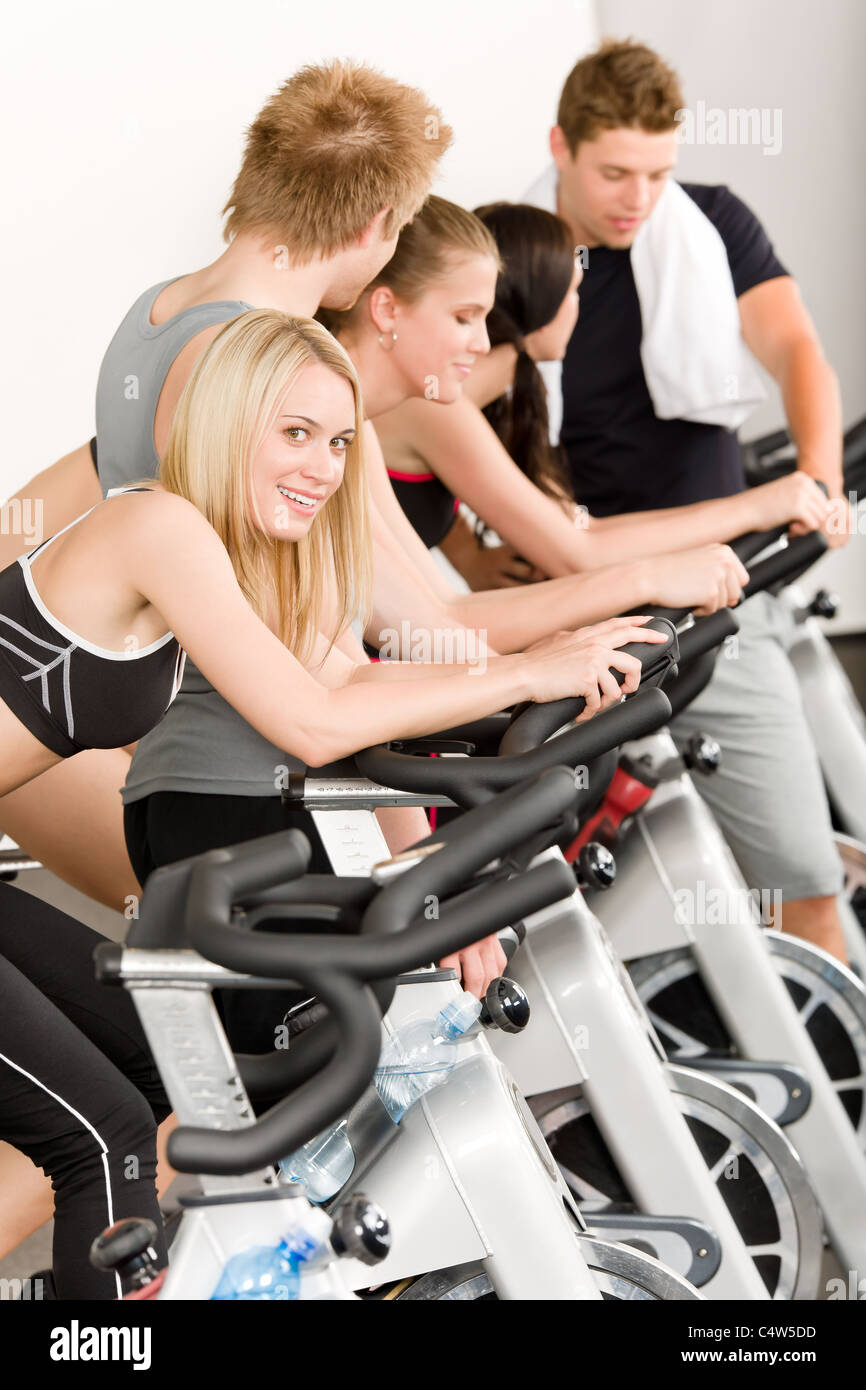 Fitness group of people on bicycle doing spinning at gym Stock Photo ...