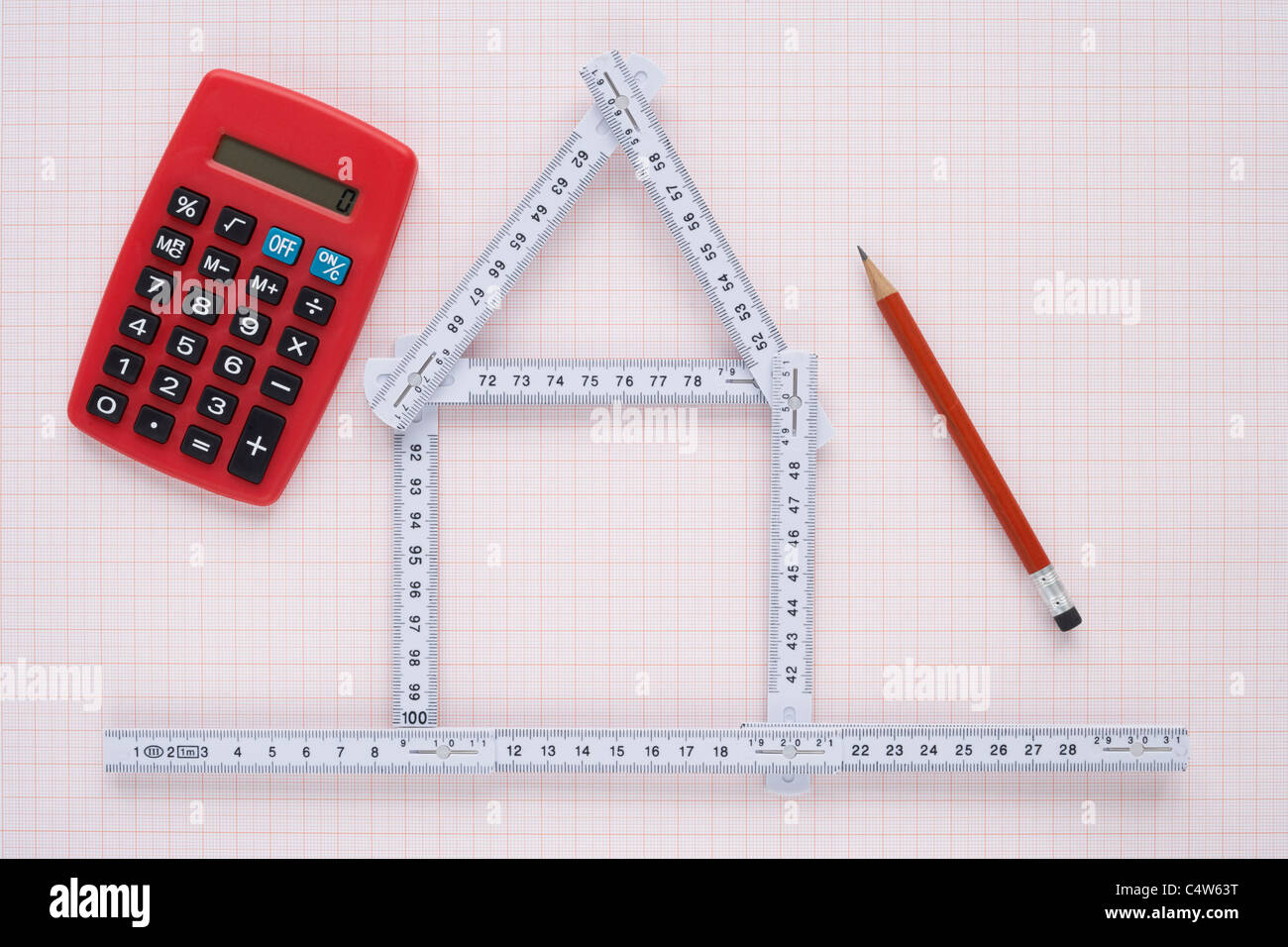 Folding Ruler in Shape of House with Pencil and Calculator Stock Photo ...