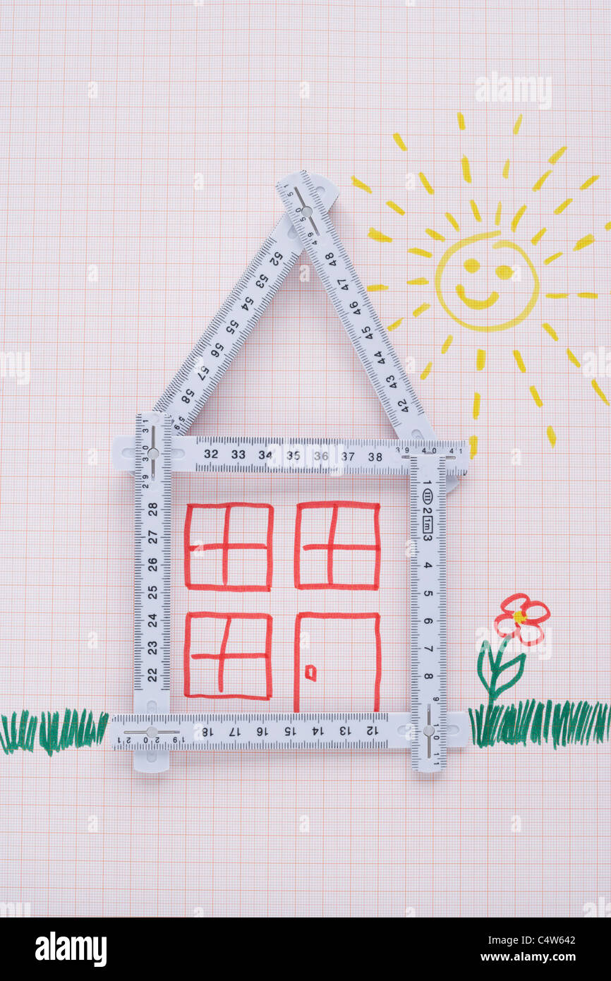 Folding Ruler in Shape of House with Drawings Stock Photo - Alamy