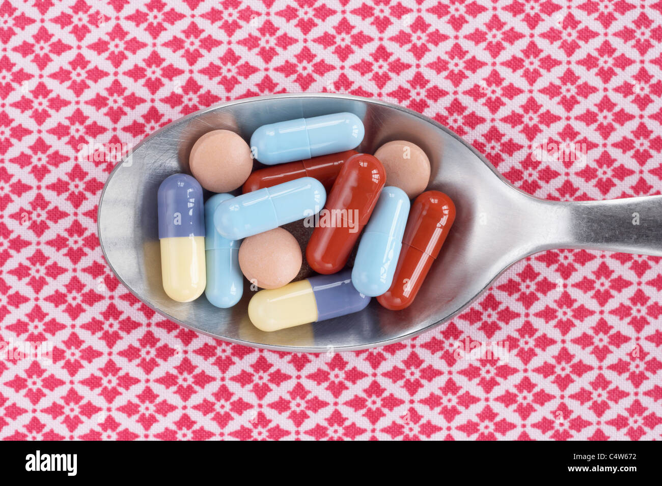 Pills on Spoon Stock Photo - Alamy