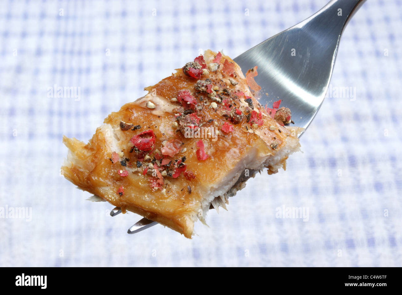a piece of smoked mackerel fillet on a fork Stock Photo - Alamy