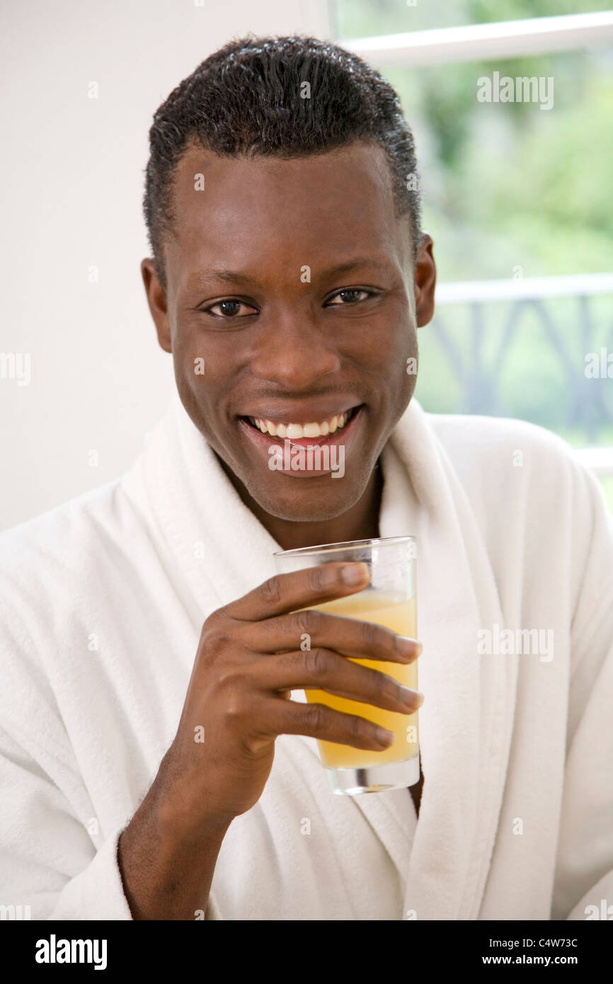 Young African Man Drinking Stock Photo - Alamy