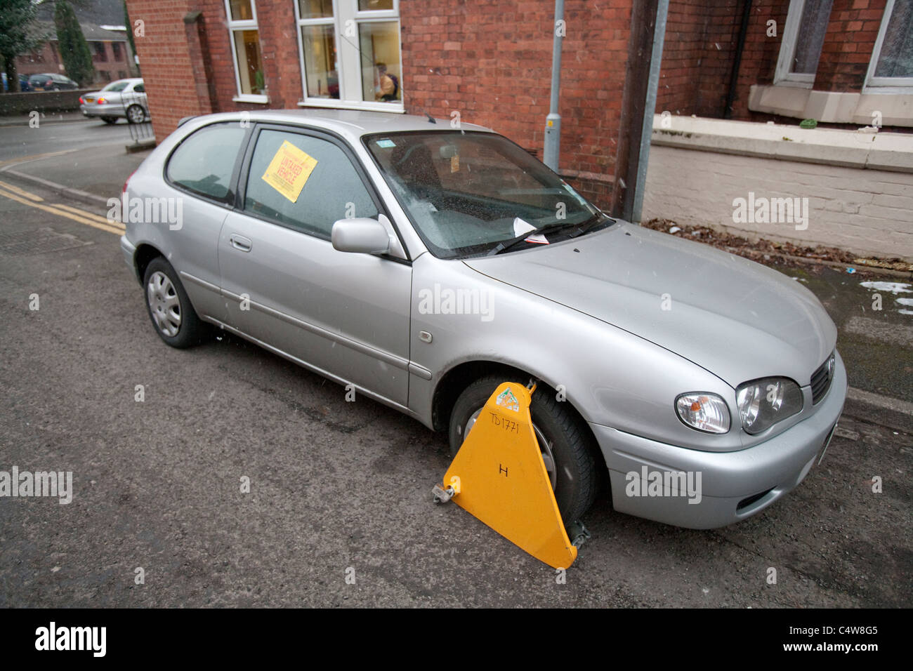 Untaxed Car clamped by the DVLA,Untaxed vehicle wheel clamped Stock ...