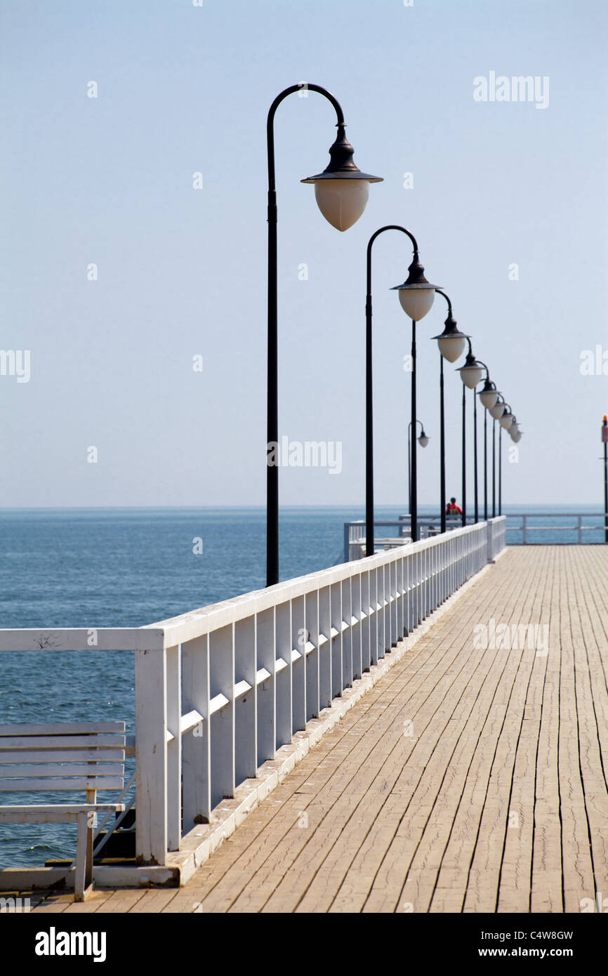 Wooden pier and lantern on the sea coast Stock Photo - Alamy