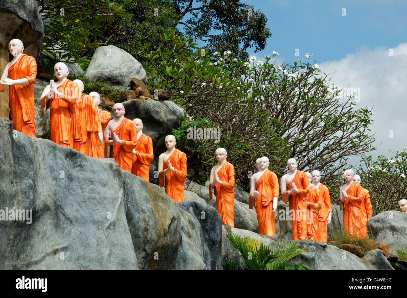 Procession of sculptured Buddhist monks Dambulla Caves Cultural ...