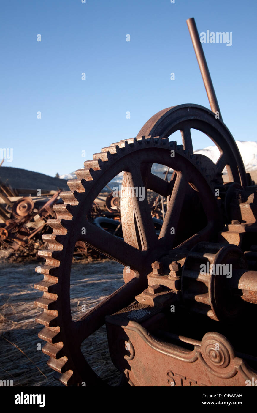 Old rustic farm equipment -- metal mechanical industrial worn wheel ...