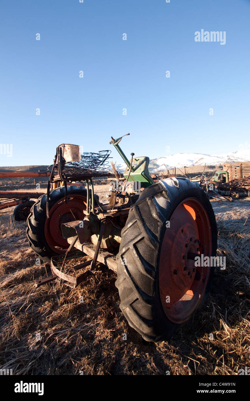 Old rustic farm equipment -- metal mechanical industrial worn wheel ...