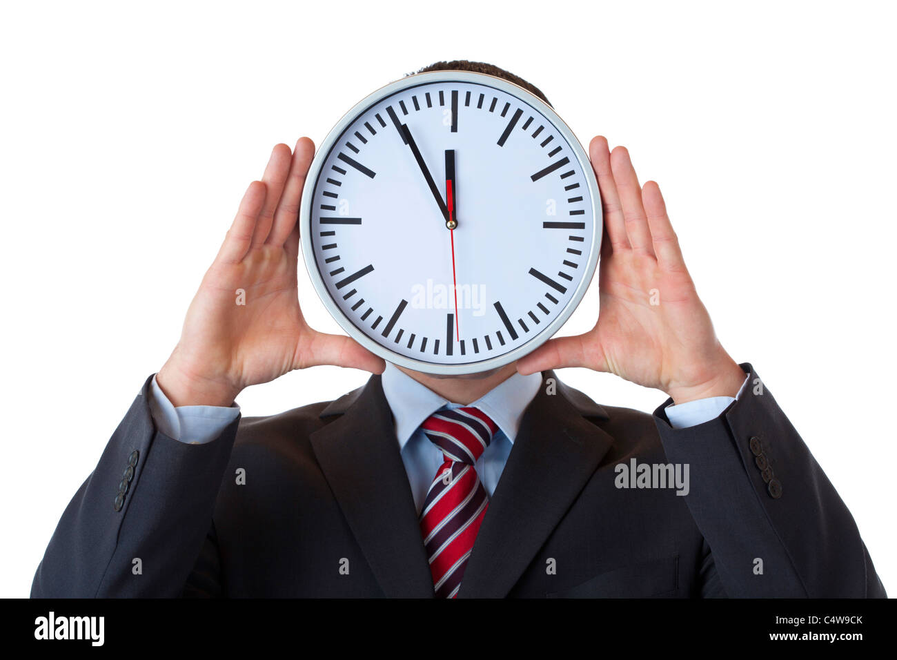 Executive holds clock in front of face as a sign of overload.Isolated ...