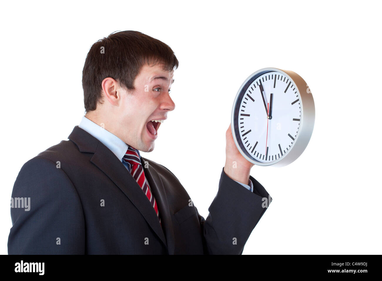 Frustrated employee holds clock in front and shouts enervated.Isolated ...