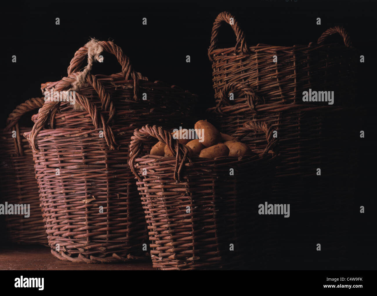 Still: Solid baskets with potatos (and fruits Stock Photo - Alamy