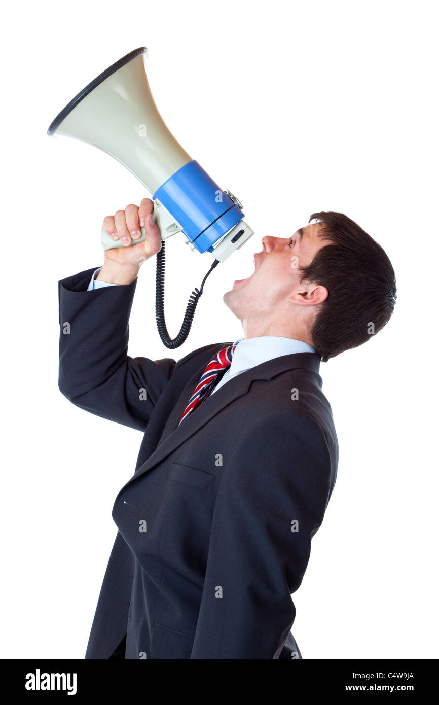 Young businessman shouts loudly into megaphone overhead.Isolated on ...