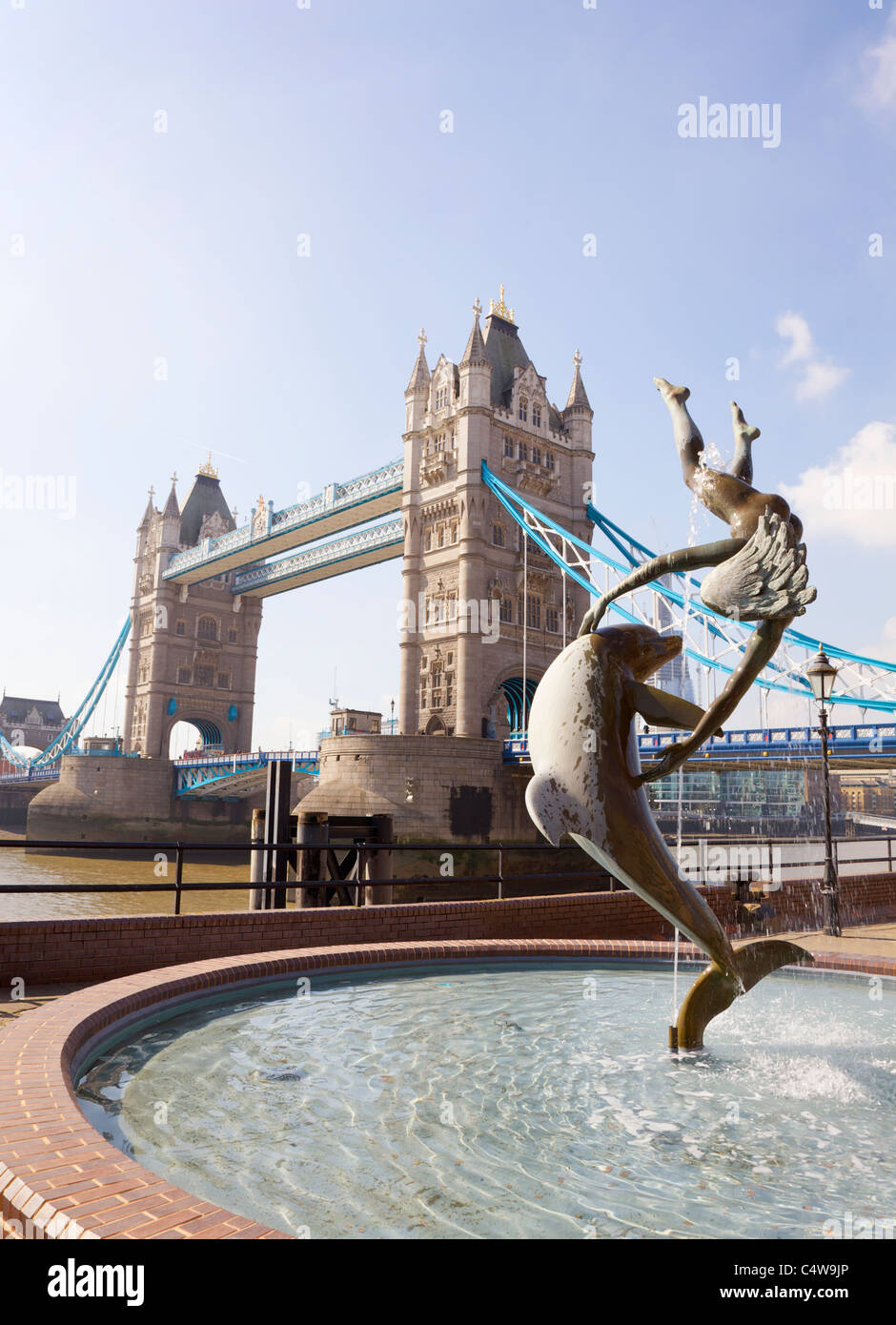 Girl and dolphin fountain by Tower Bridge, London Stock Photo - Alamy
