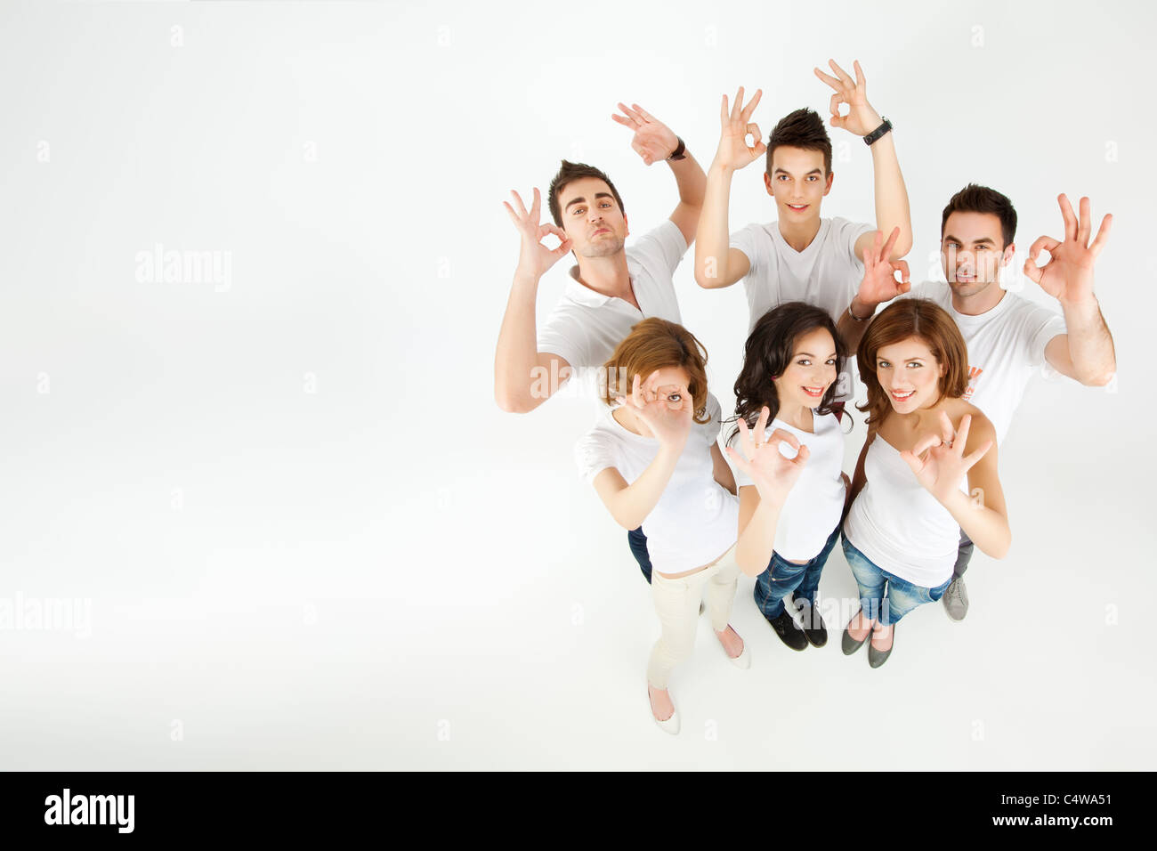 group of people smiling, approving at the camera Stock Photo - Alamy