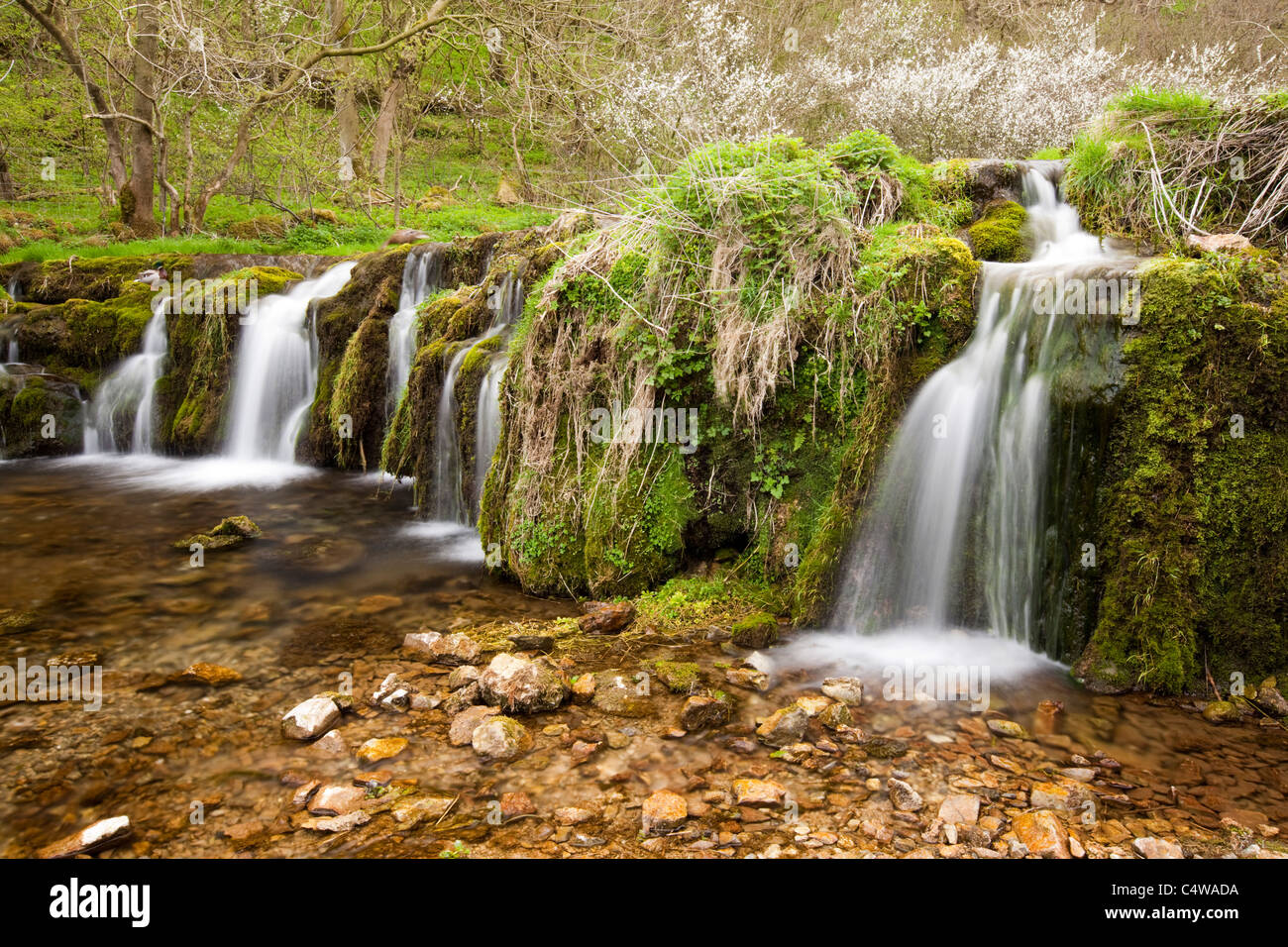 Small waterfall/ weir in Lathkilldale Derbyshire Peak District Stock ...