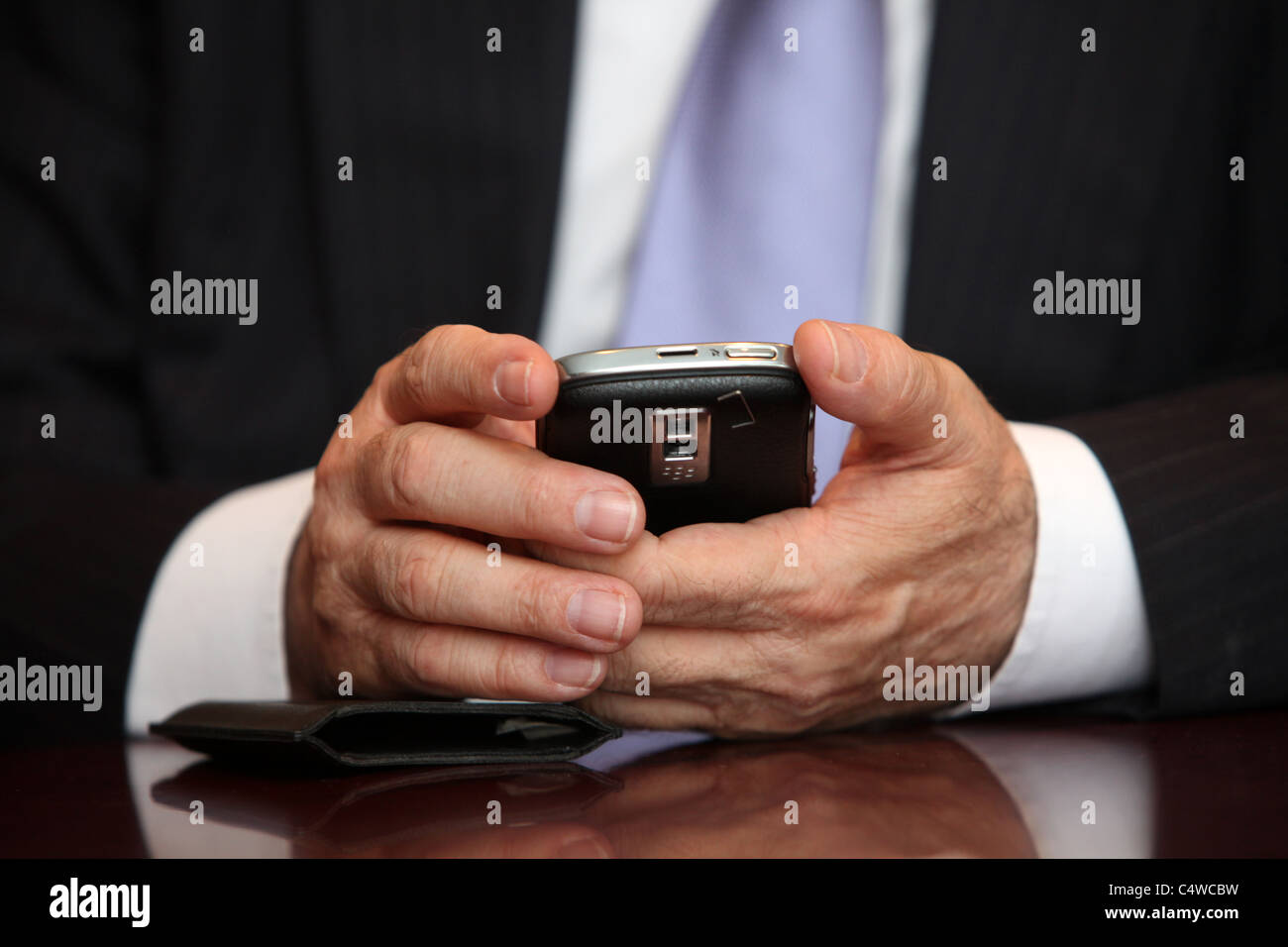 Man using mobile phone, close-up of hands Stock Photo - Alamy