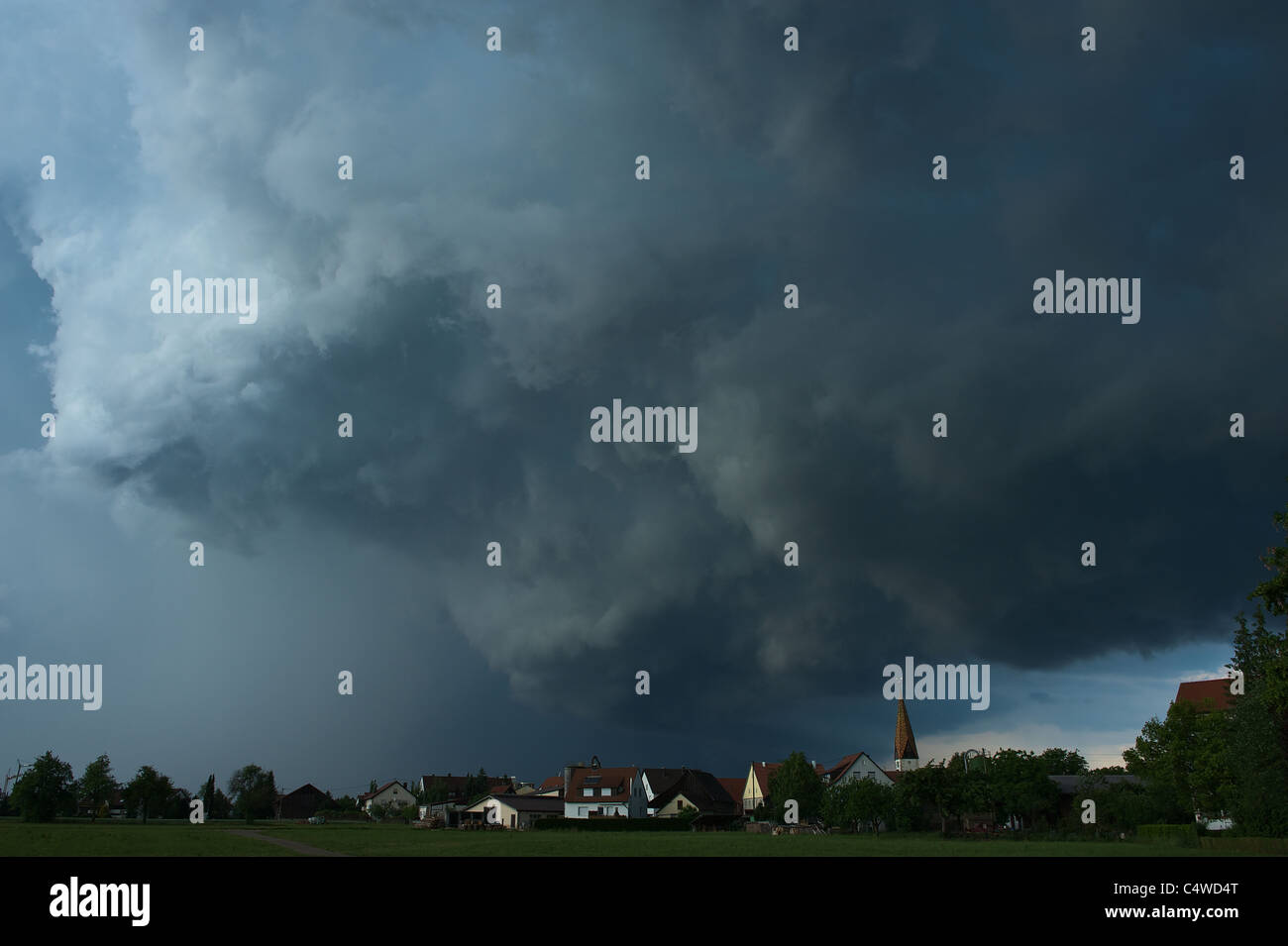 Storm clouds over village in Germany Stock Photo - Alamy