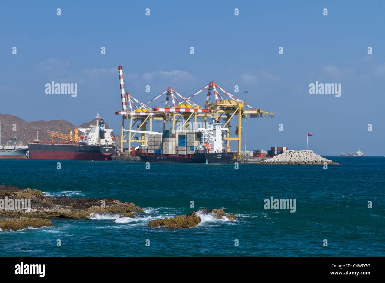 Container loading cranes in the port city of Muscat, Oman Stock Photo ...