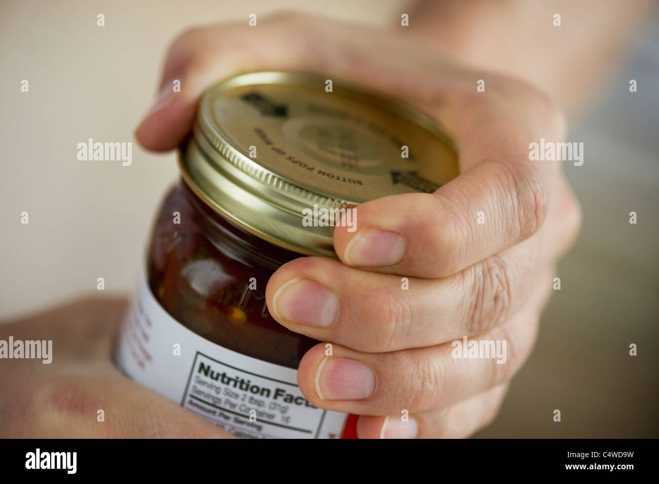 Man opening jar Stock Photo - Alamy