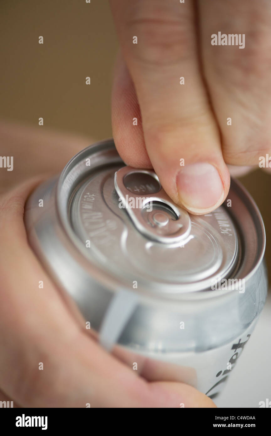 Man opening drink can Stock Photo - Alamy