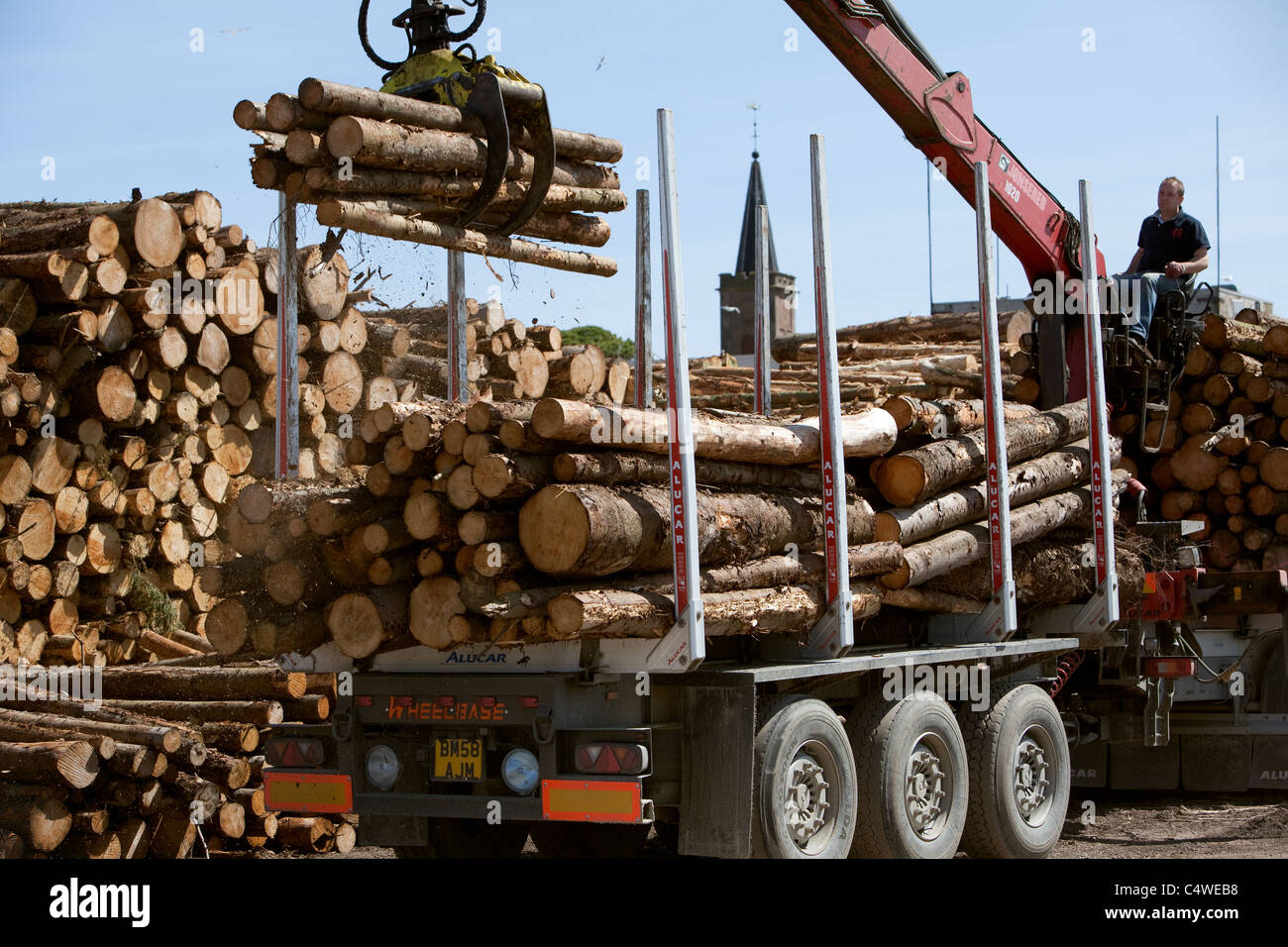 Logging industry Stacking timber cut from local forests, awaiting ...