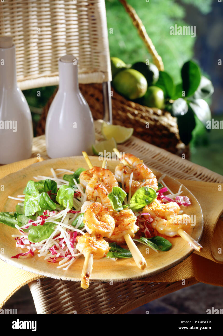 Prawn - saté spits with spinach salad Stock Photo - Alamy