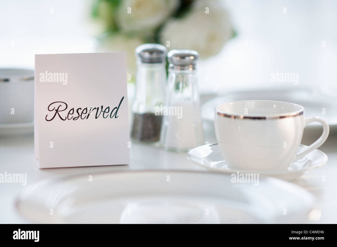 Close up of place setting with reserved sign Stock Photo - Alamy