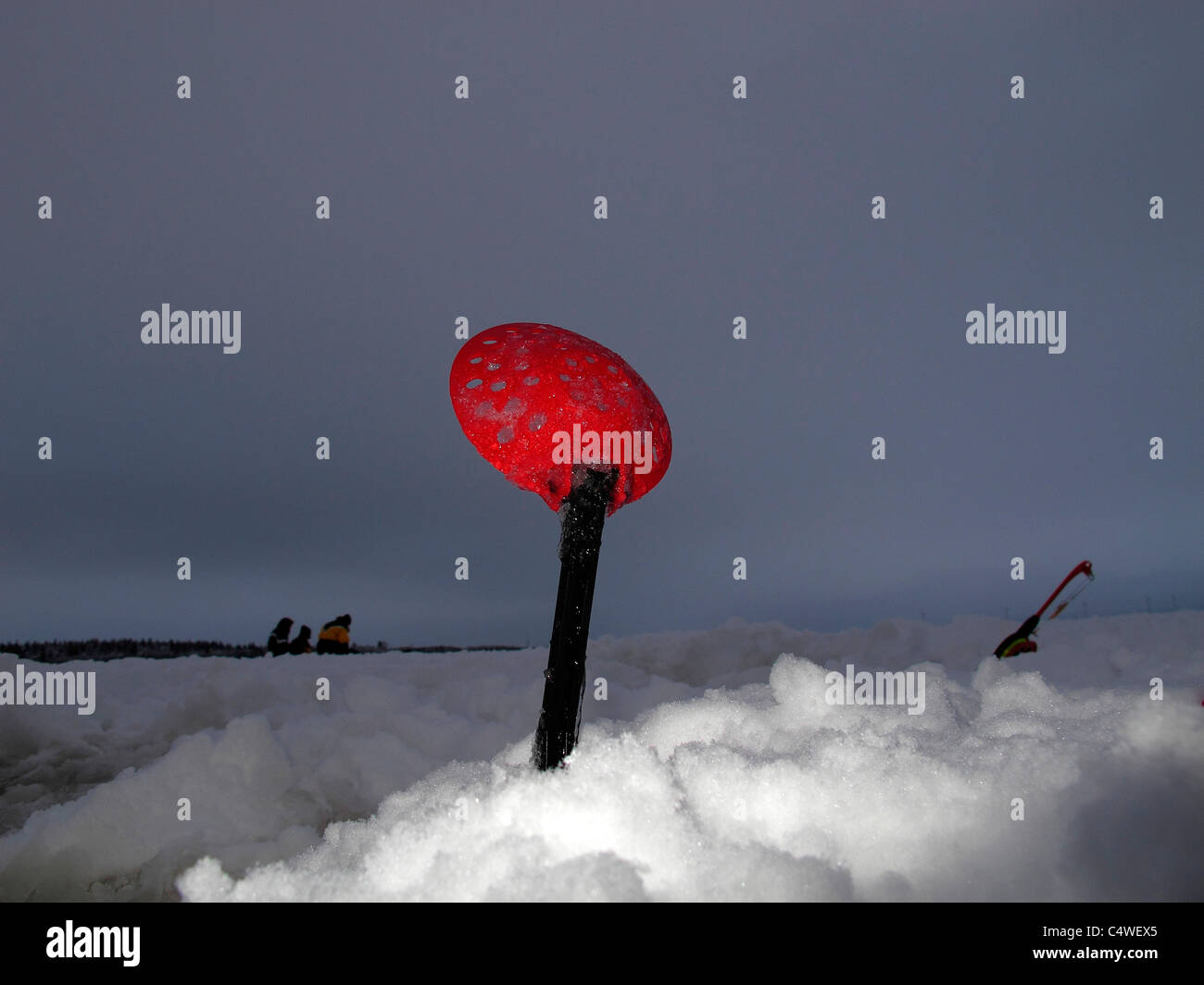 Scandinavia Finland ice fishing on frozen ice lake. A metal Sieve used ...