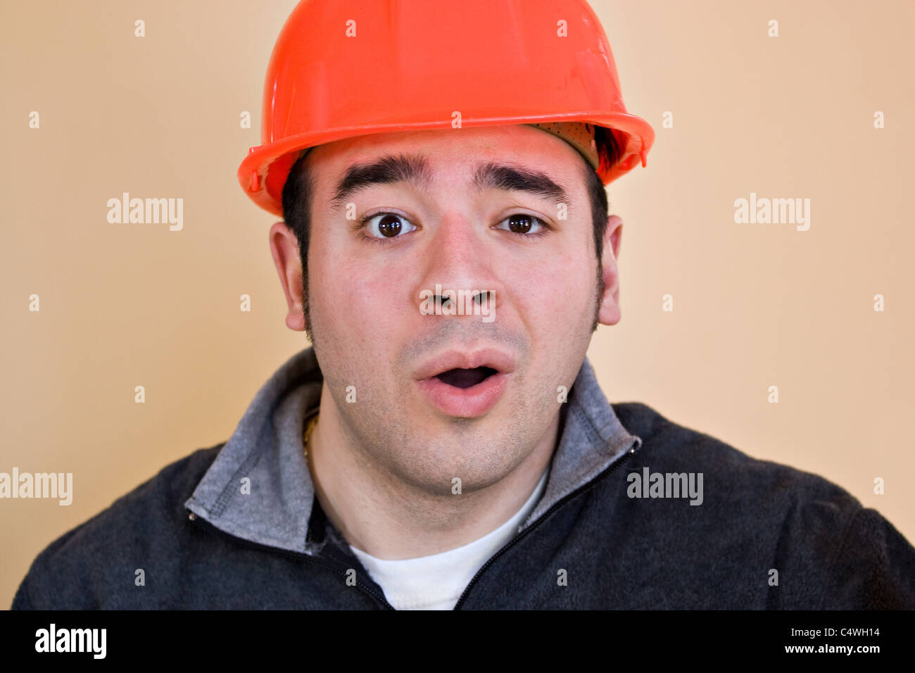 This construction worker is looking very confused Stock Photo - Alamy
