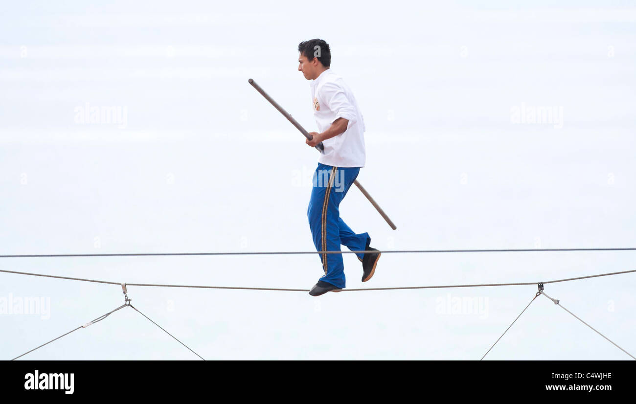 Chico Marinhos of Zippos Circus walks along a wire 80ft above the ...