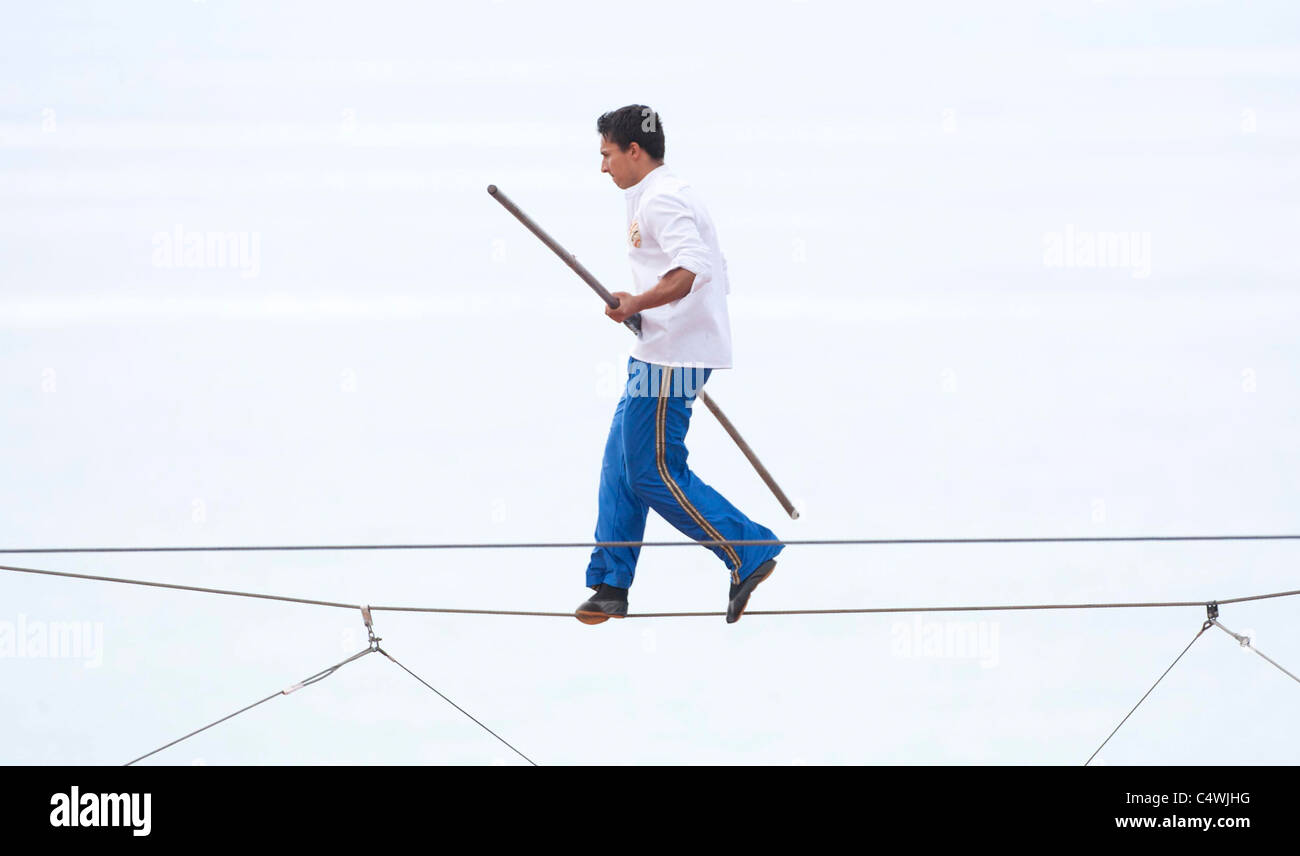 Chico Marinhos of Zippos Circus walks along a wire 80ft above the ...