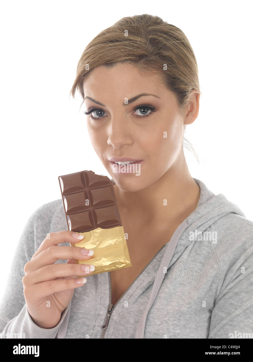 Young Woman Eating Chocolate Bar. Model Released Stock Photo - Alamy