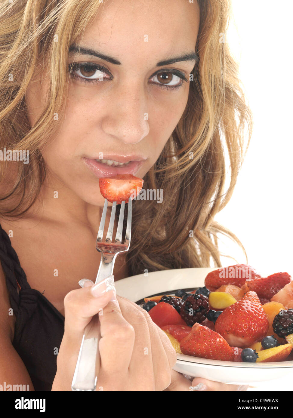 Young Woman Eating Fruit Salad. Model Released Stock Photo - Alamy
