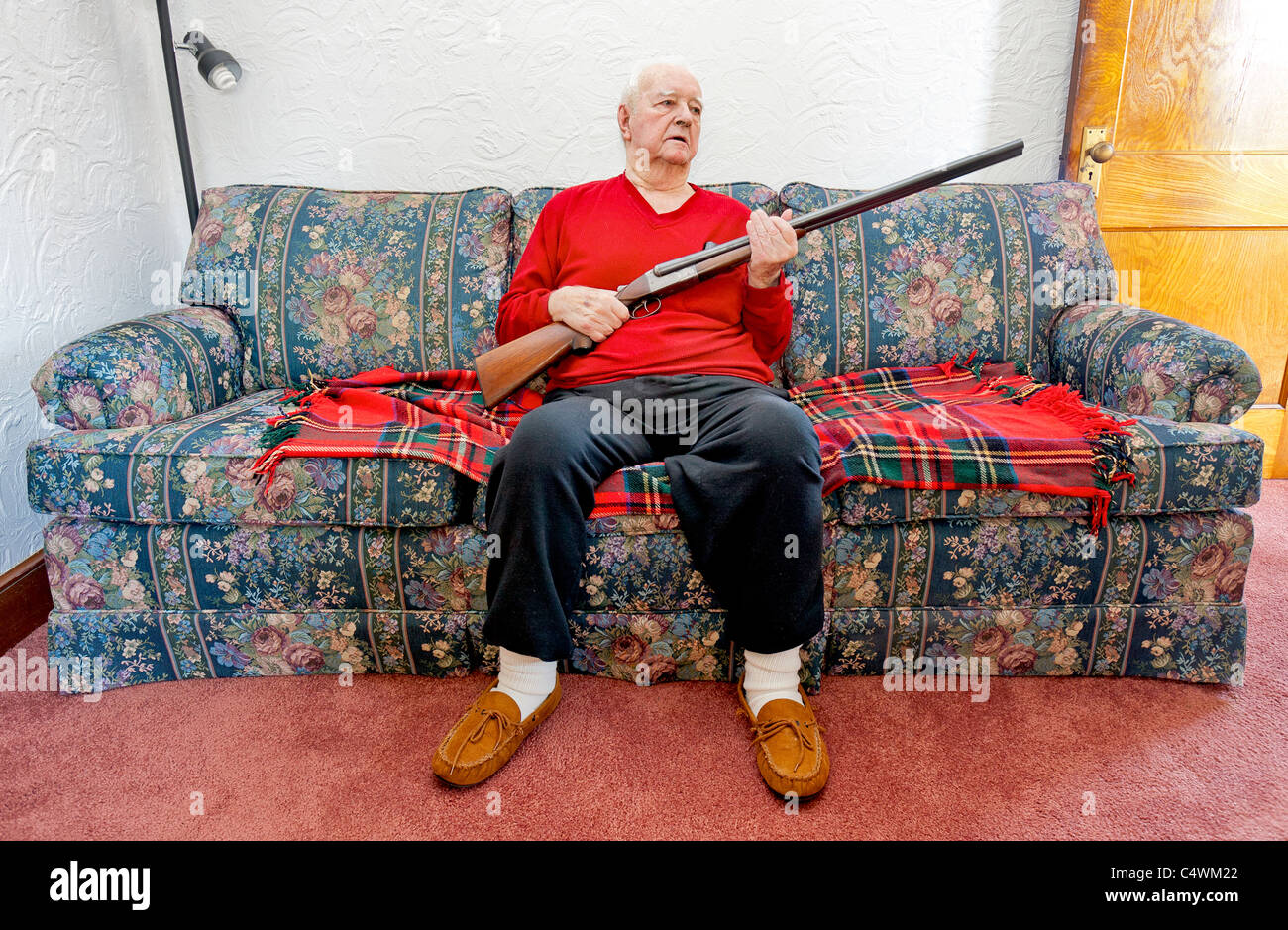 A retired elderly Senior Man holding a shotgun Stock Photo - Alamy