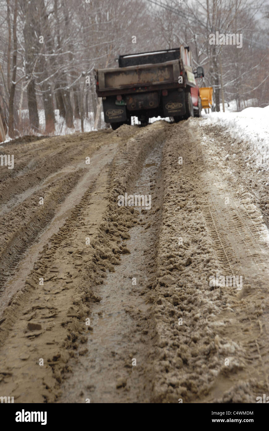 A truck makes it’s way along a muddy road during mud season in Vermont ...