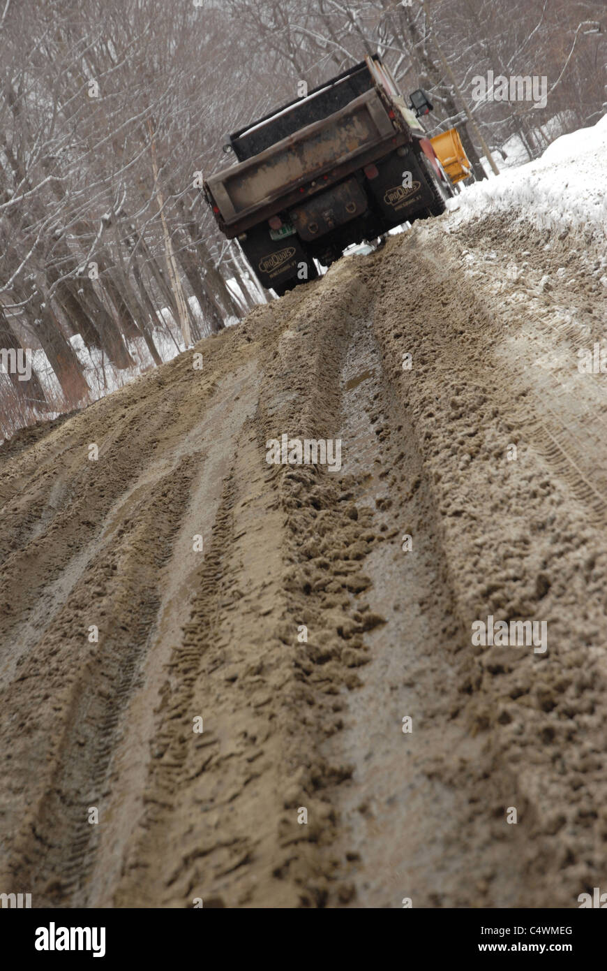 A truck makes it’s way along a muddy road during mud season in Vermont ...