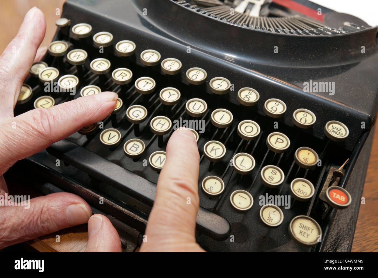 A retired elderly Senior Man typing on a typewriter Stock Photo - Alamy