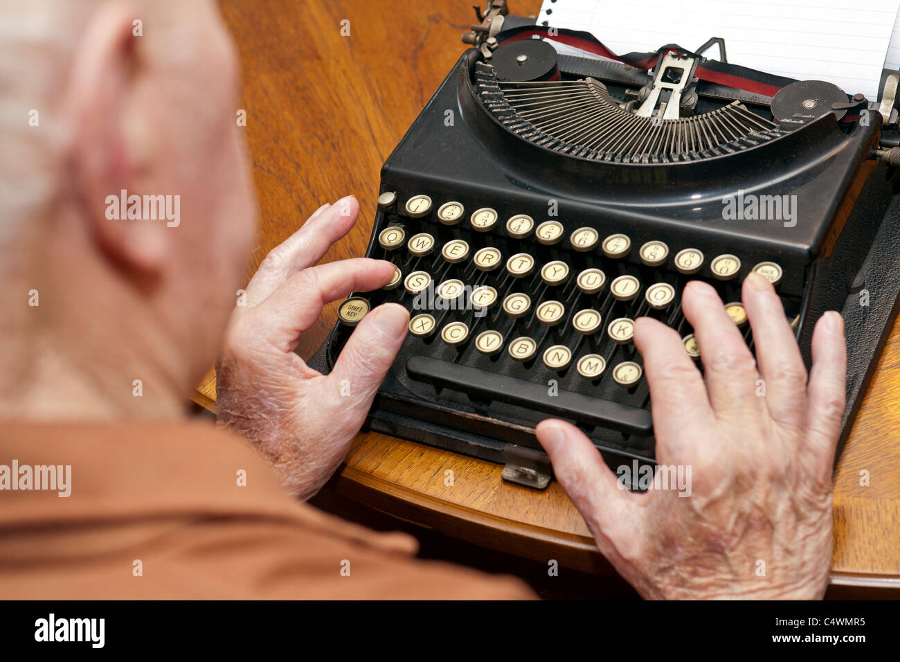 A retired elderly Senior Man typing on a typewriter Stock Photo - Alamy